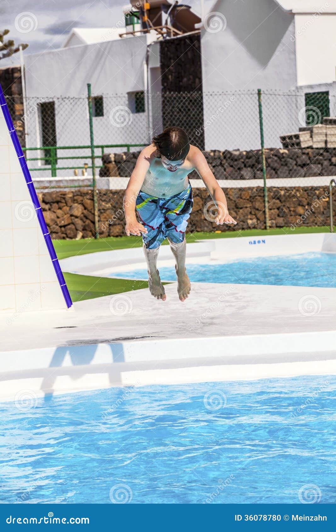 Boy Jumping in the Blue Pool Stock Photo - Image of outdoor, action ...