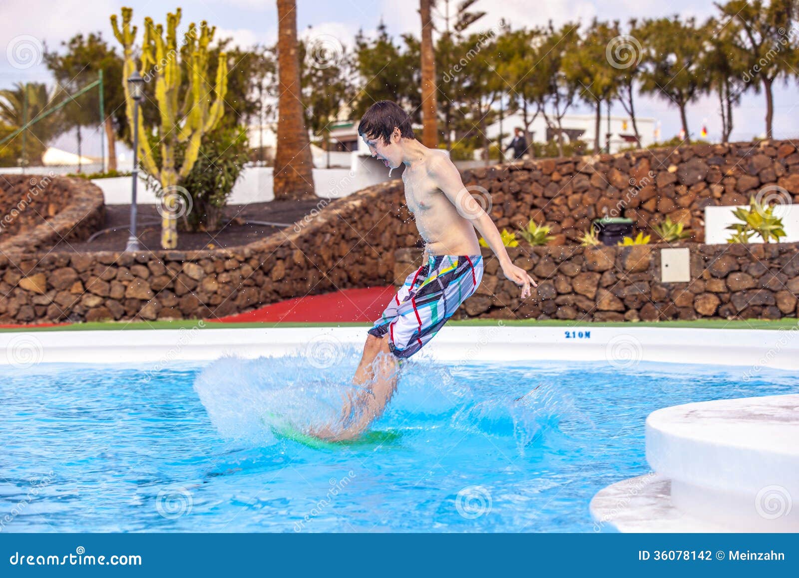 Boy Jumping in the Blue Pool Stock Photo - Image of hands, cool: 36078142