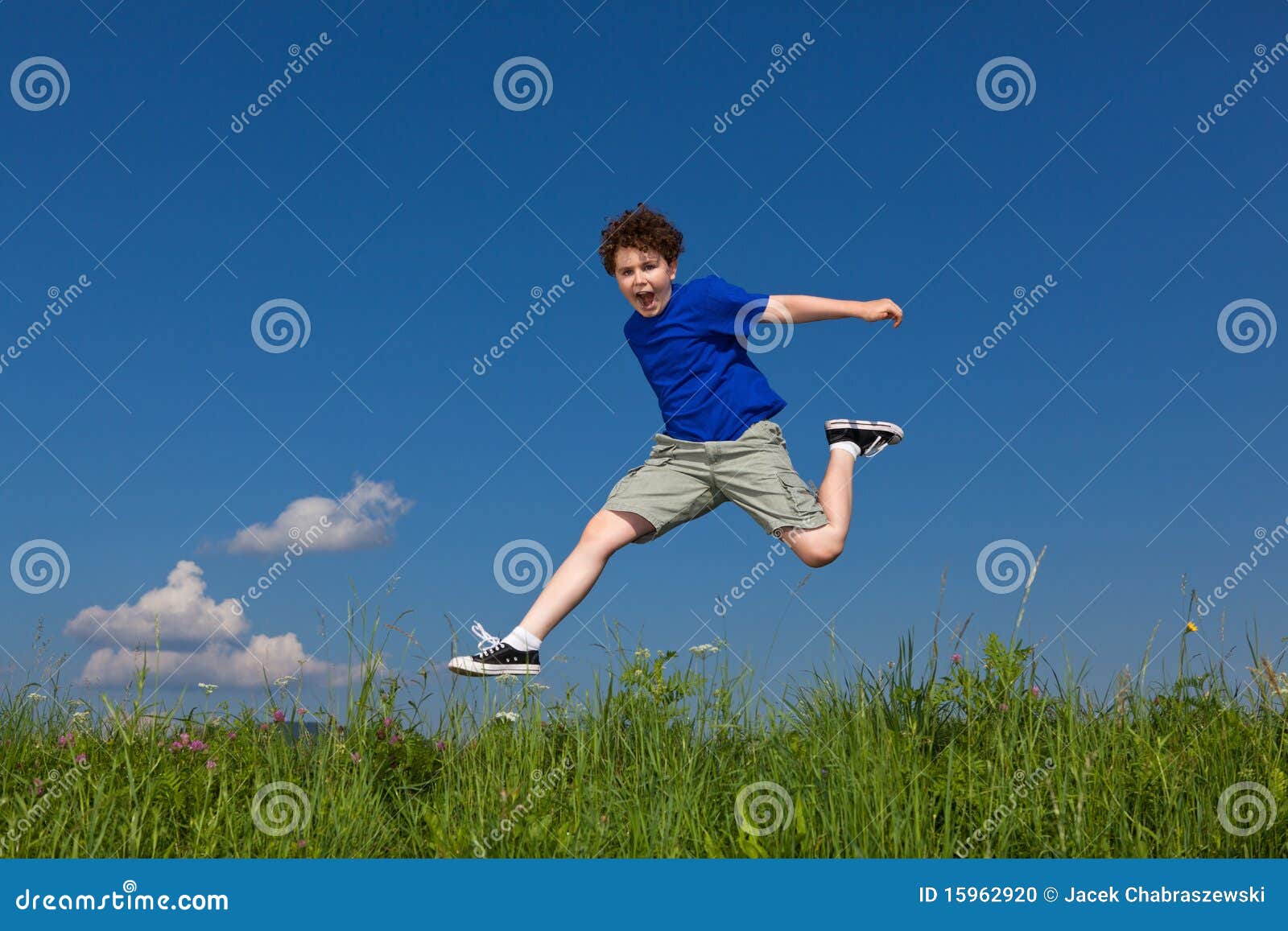 Boy jumping outdoor stock photo. Image of exercising - 15962920