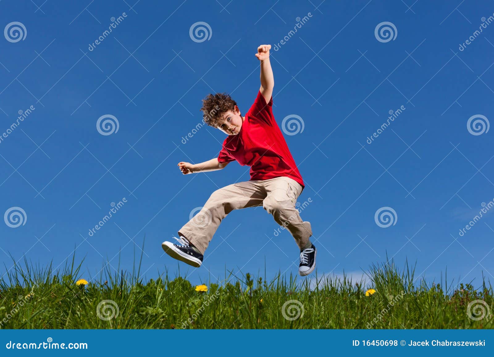 Boy jumping outdoor stock photo. Image of jogging, happy - 16450698