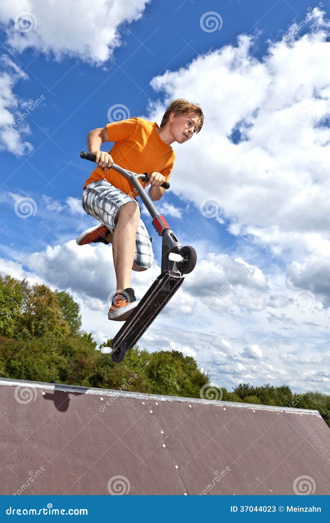 Boy Jumping Over a Ramp with His Stock Image - Image of caucasian ...