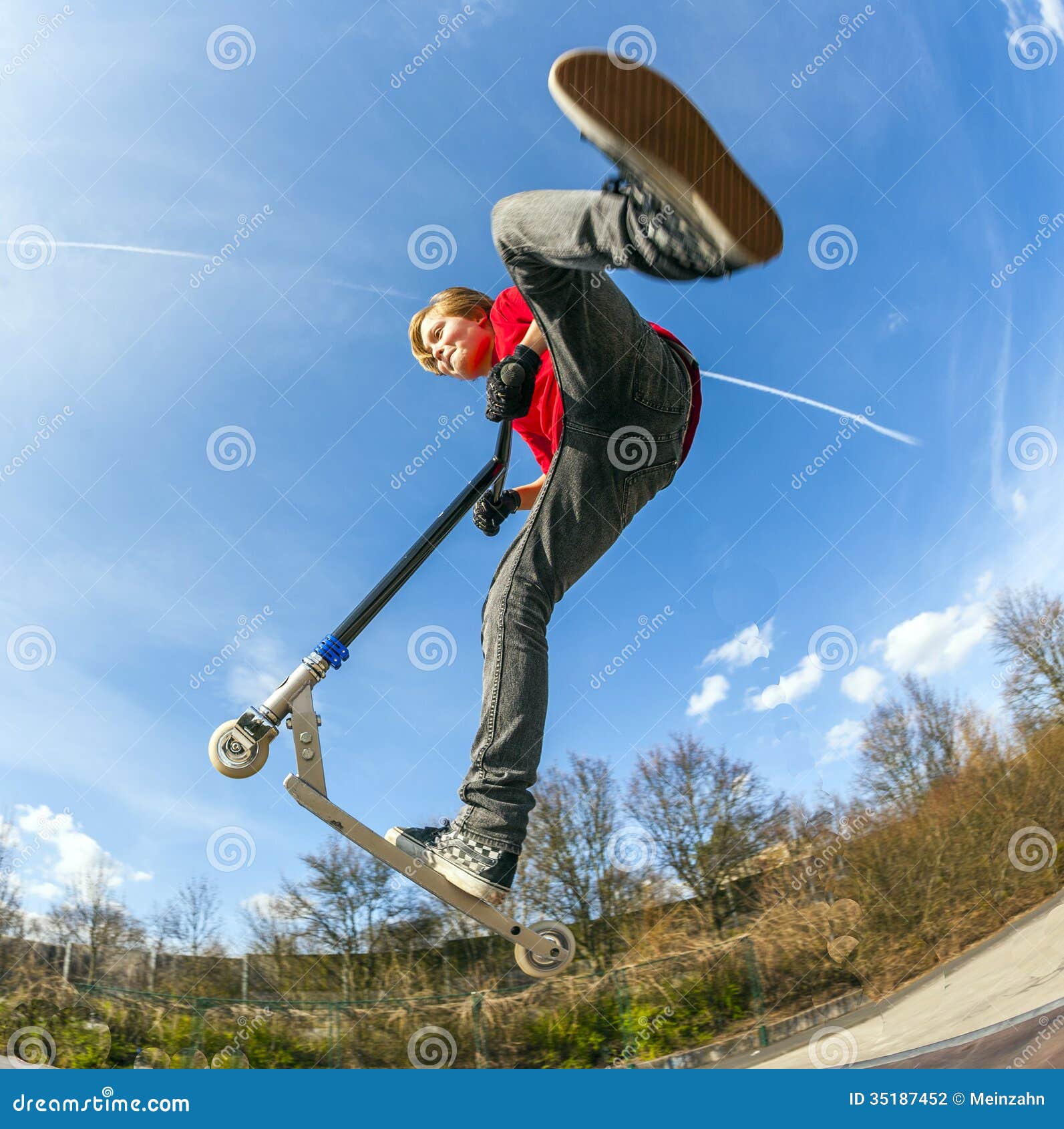 Boy jumping with a scooter stock photo. Image of motion - 35187452