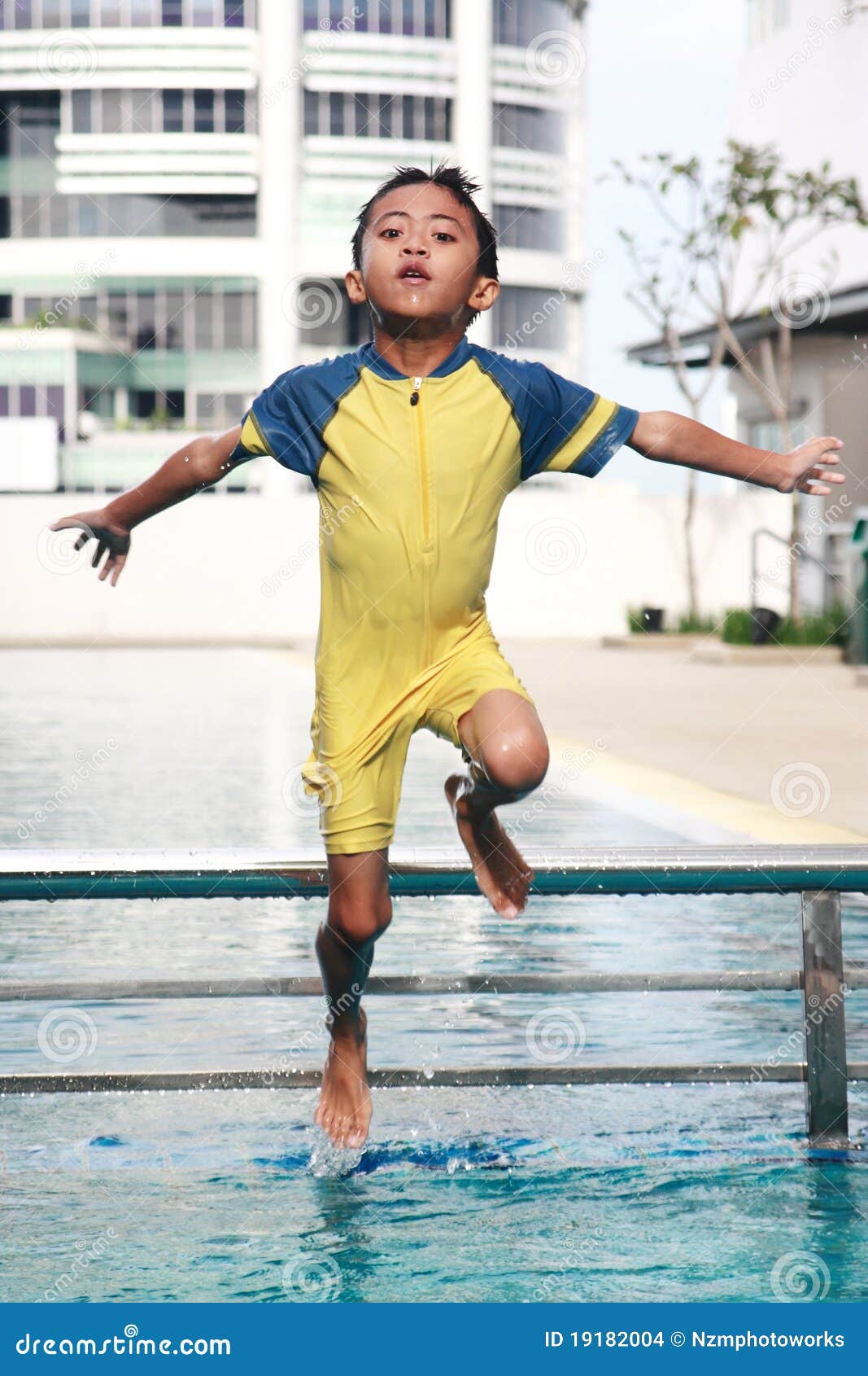 Boy Jumping into Swimming Pool Stock Photo - Image of hotel, playful ...