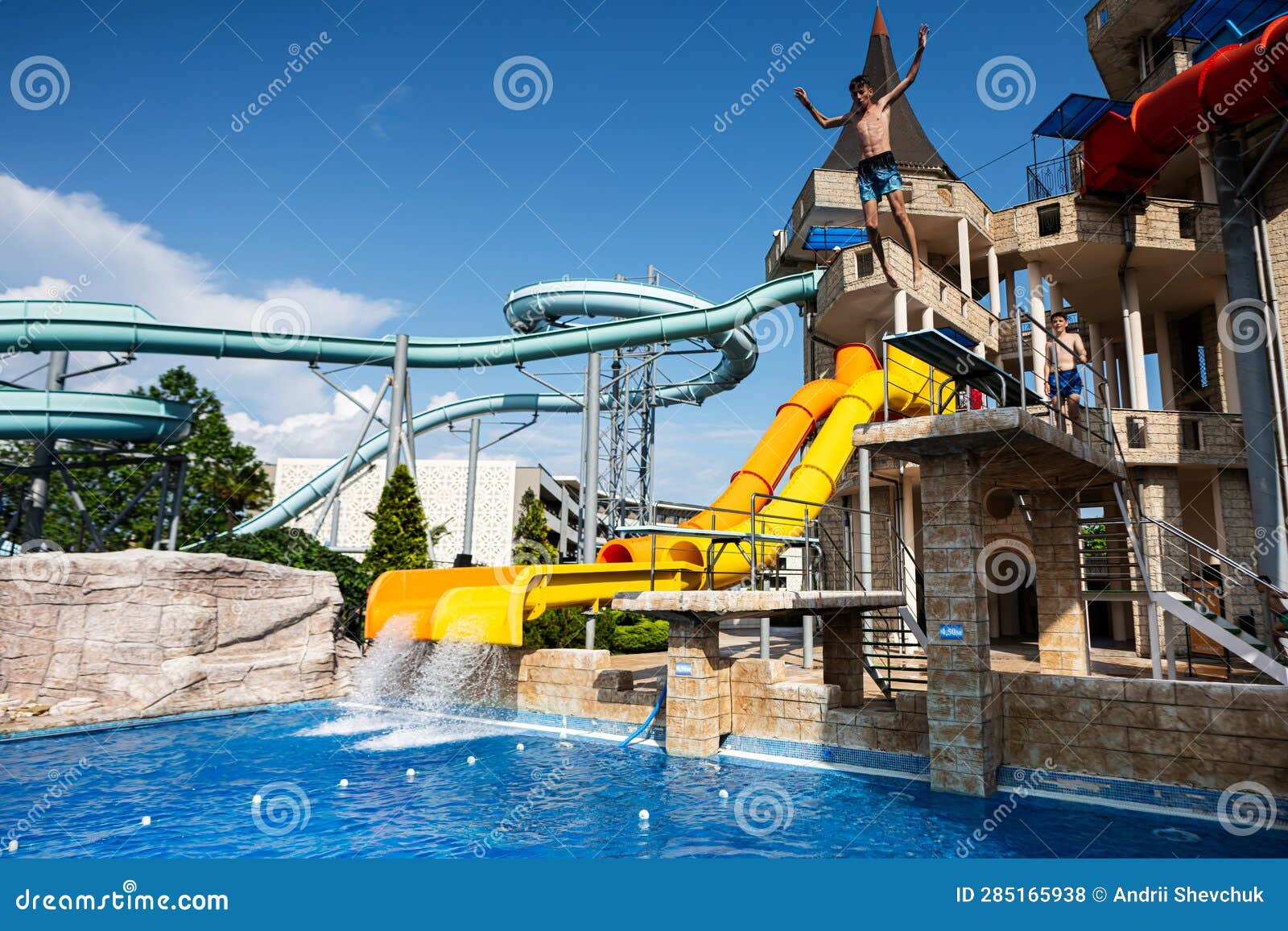 Boy Jumping from Trampoline at Water Slides at the Theme Aqua Park ...