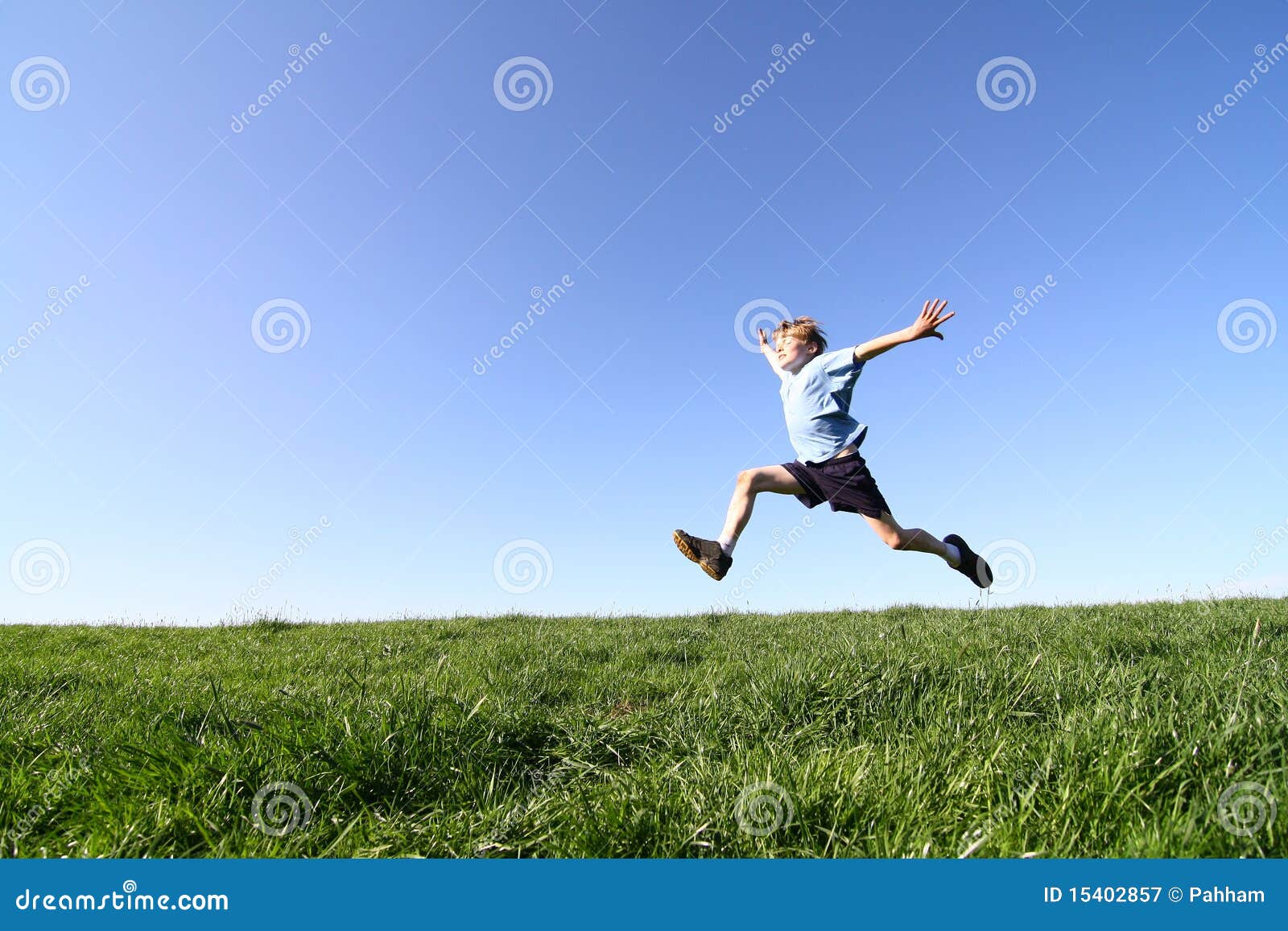 Boy jumps stock image. Image of child, male, play, playful - 15402857