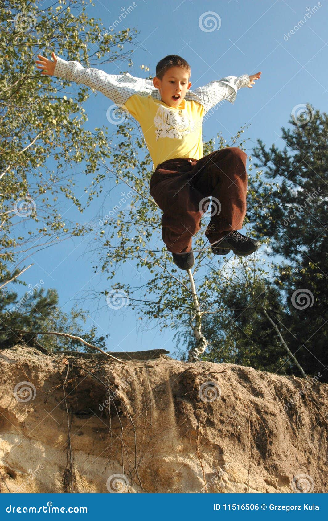 Boy jumps above the chasm stock photo. Image of nature - 11516506