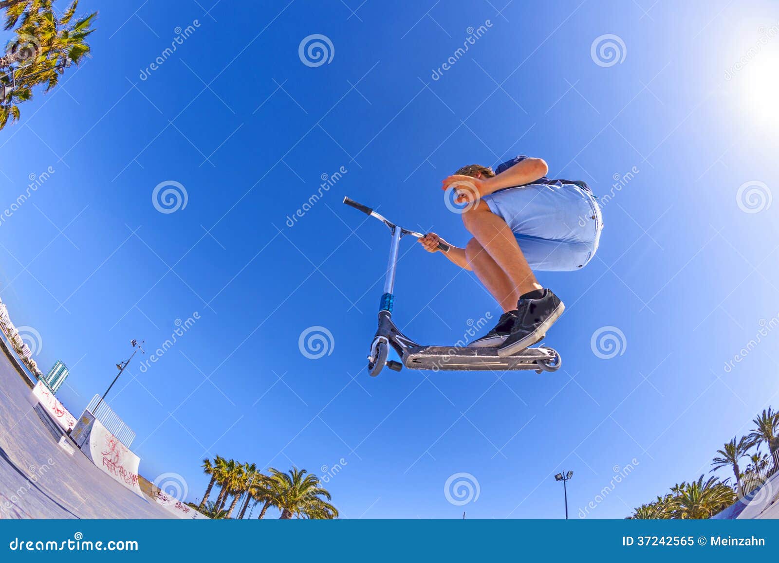 Boy Jumps with His Scooter at a Skate Park Stock Image - Image of ...
