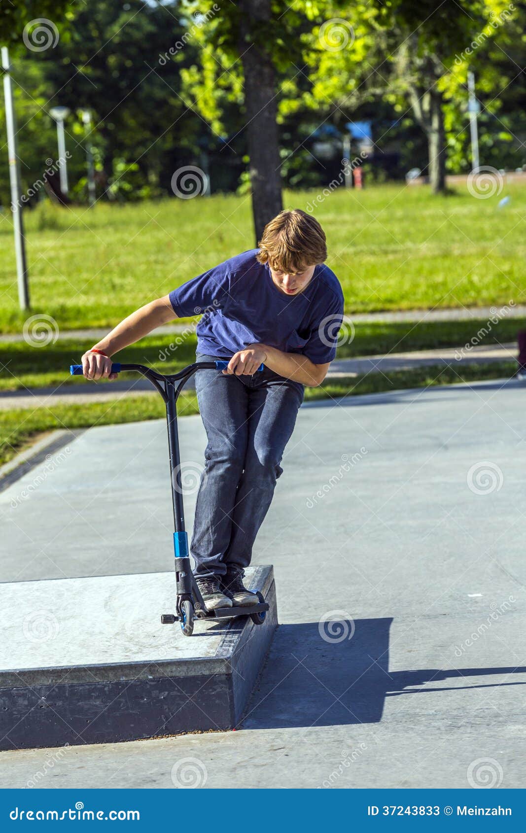 Boy Jumps with His Scooter at a Skate Park Stock Image - Image of ...