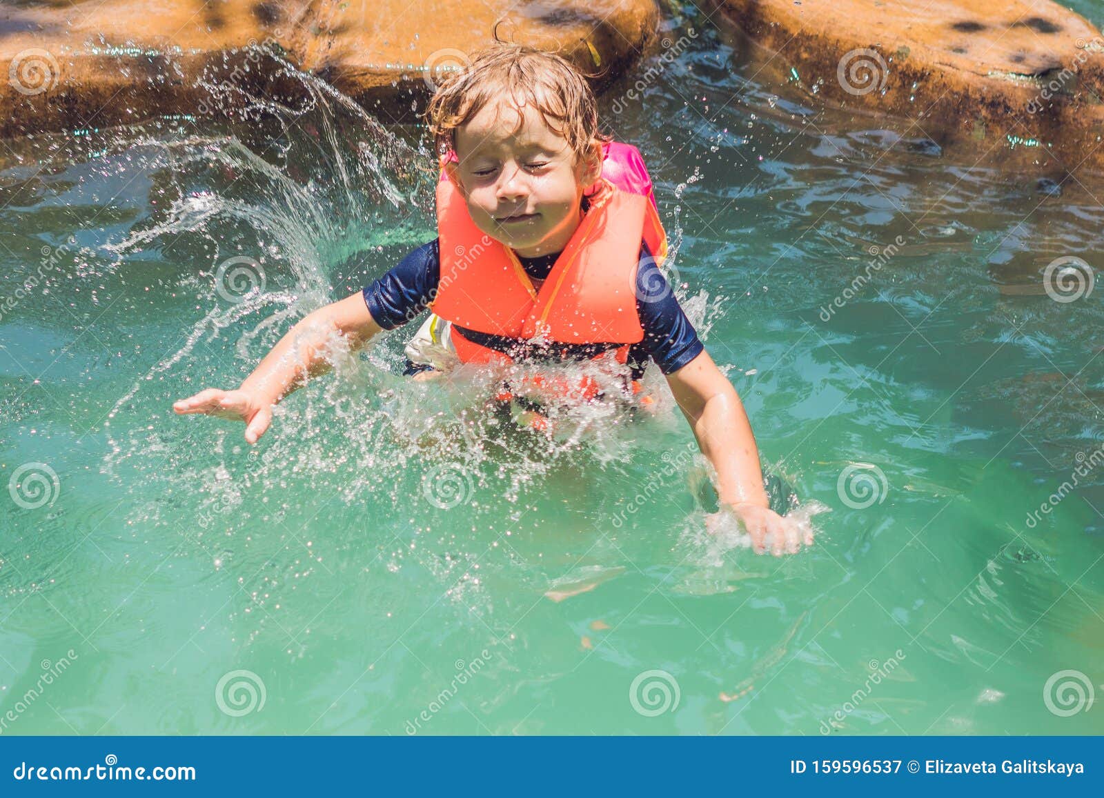 A Boy Jumps into the Water in a Pool Stock Image - Image of blue ...