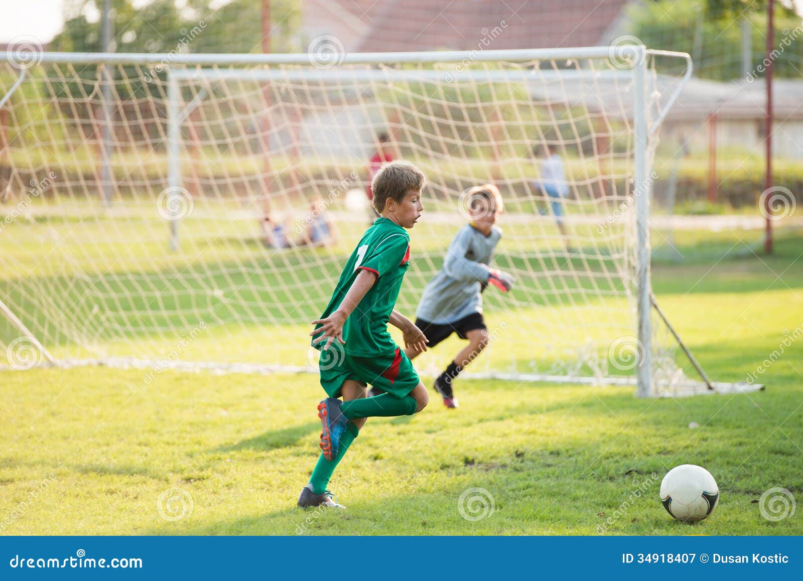 Boy kicking a ball stock image. Image of activity, boys - 34918407