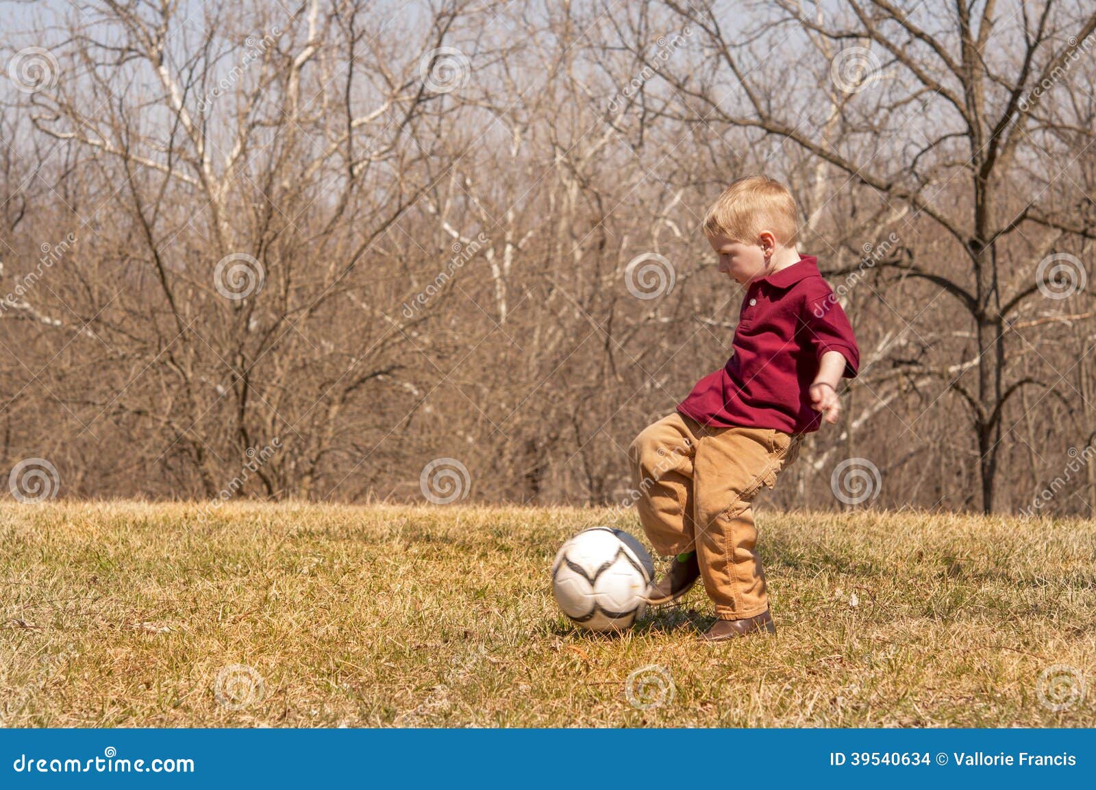 Boy kicking ball stock photo. Image of male, kicking - 39540634