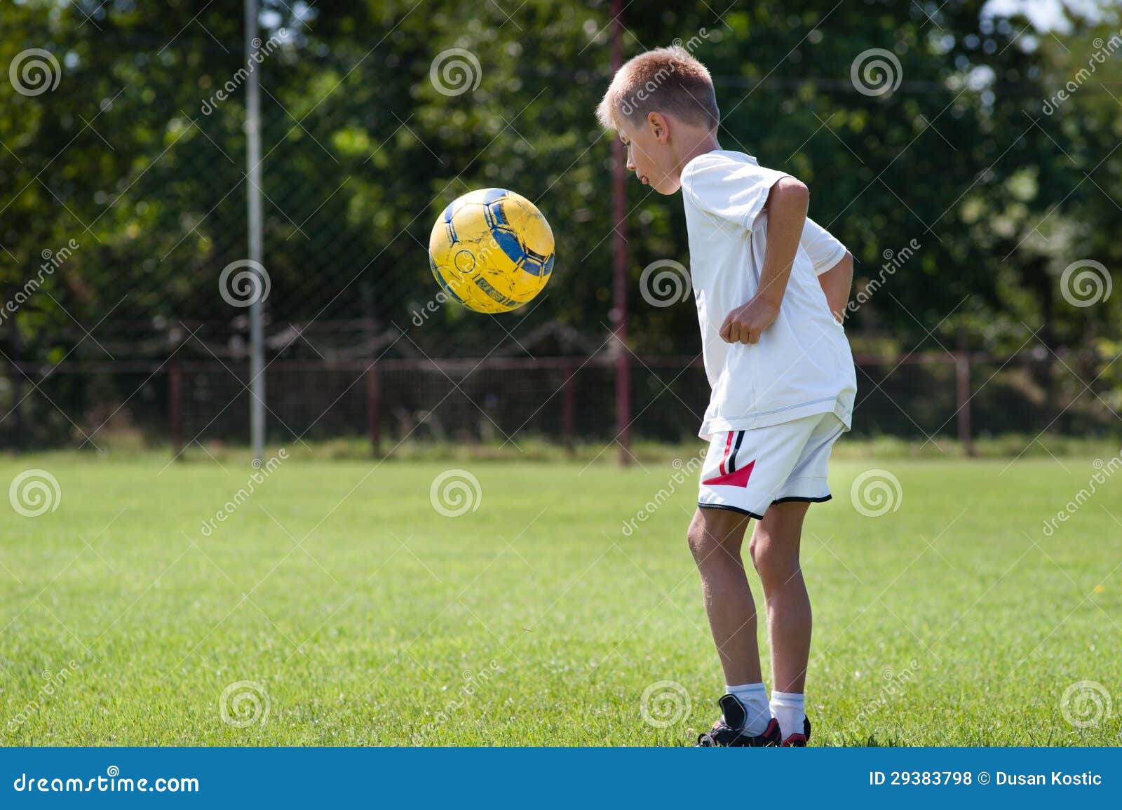 Boy kicking football stock photo. Image of excitement - 29383798