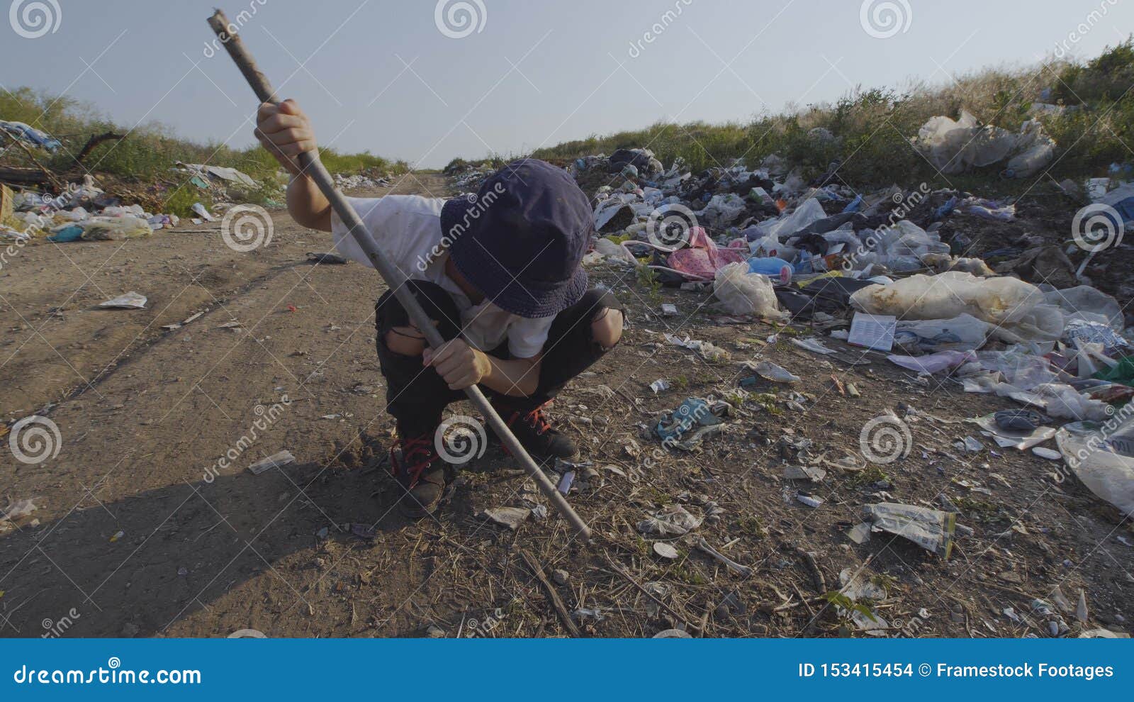 Boy Kicking Plastic Can in Dump Stock Photo - Image of despair, kicking ...