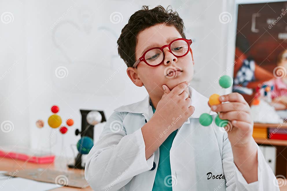 Boy, Lab Coat and Molecule Model in Classroom with Thinking, Glasses ...