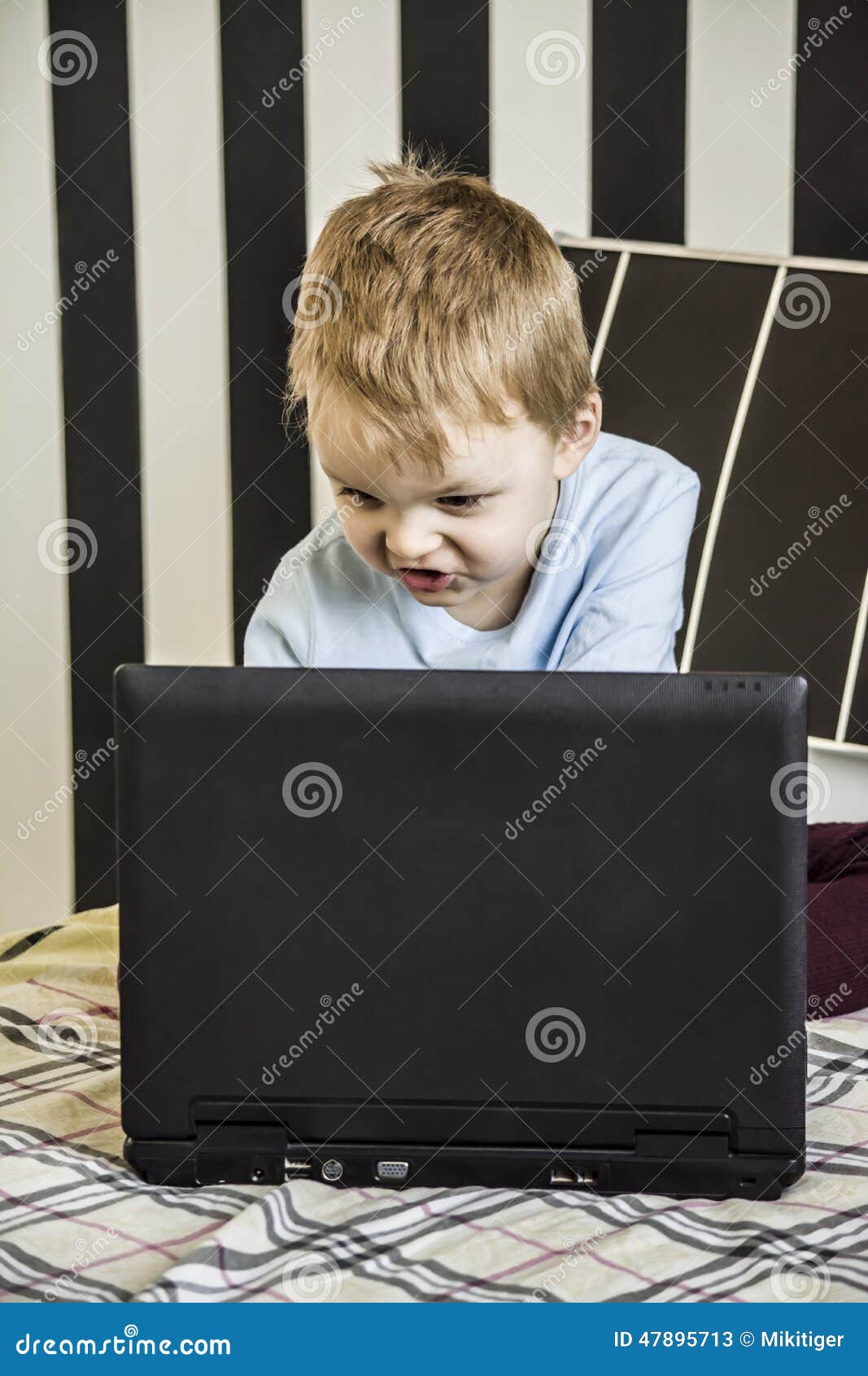 A boy and a laptop stock image. Image of play, face, bathroom - 47895713