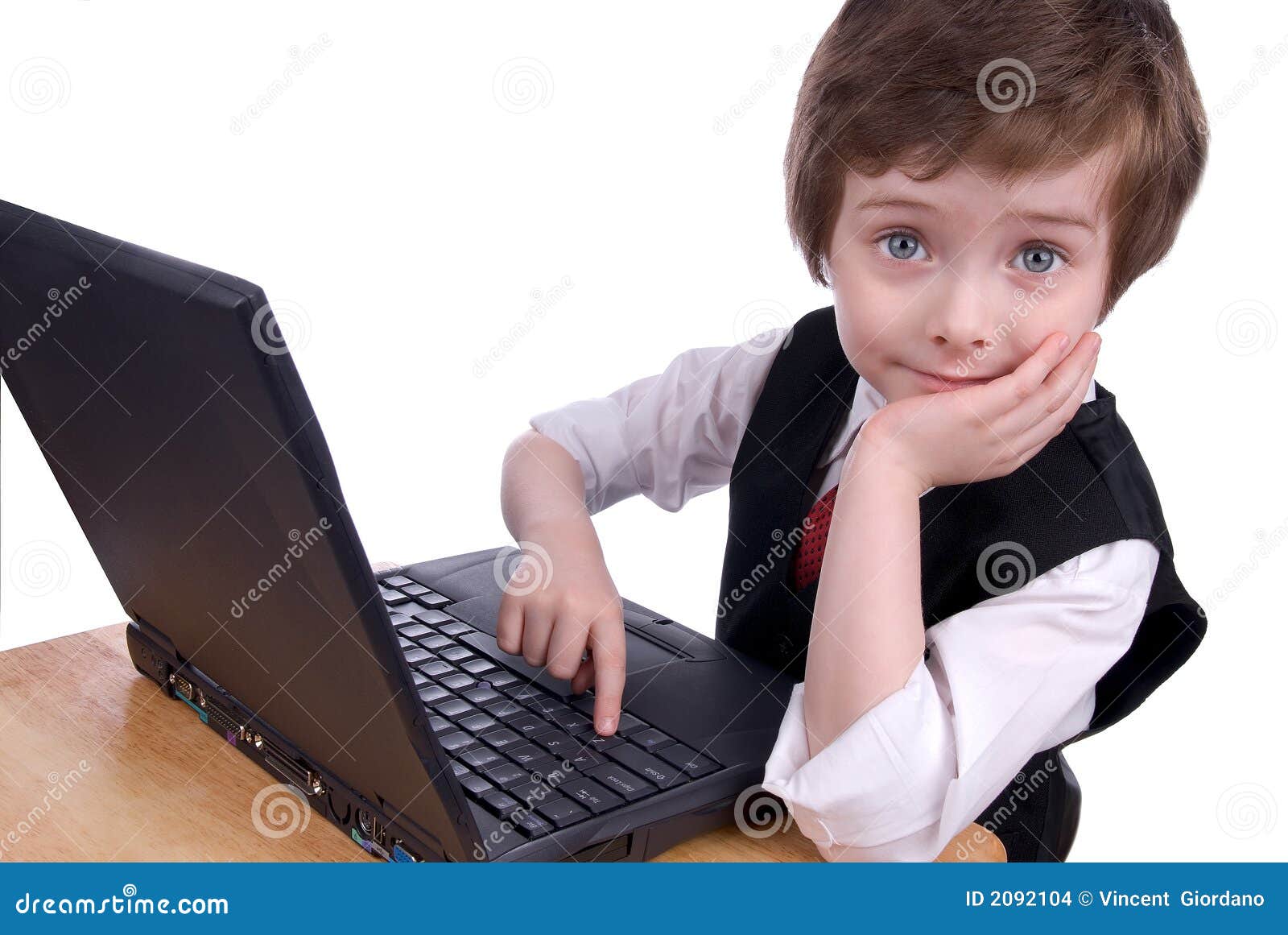 Boy on a laptop computer stock photo. Image of business - 2092104