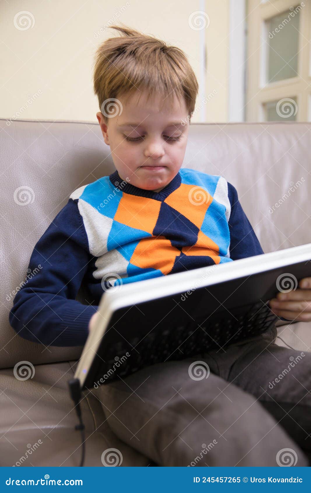 Boy with Laptop on Couch at Home Stock Image - Image of multitasking ...