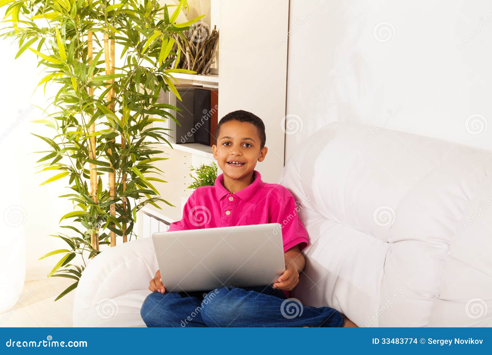 Boy with laptop stock photo. Image of indoors, black - 33483774