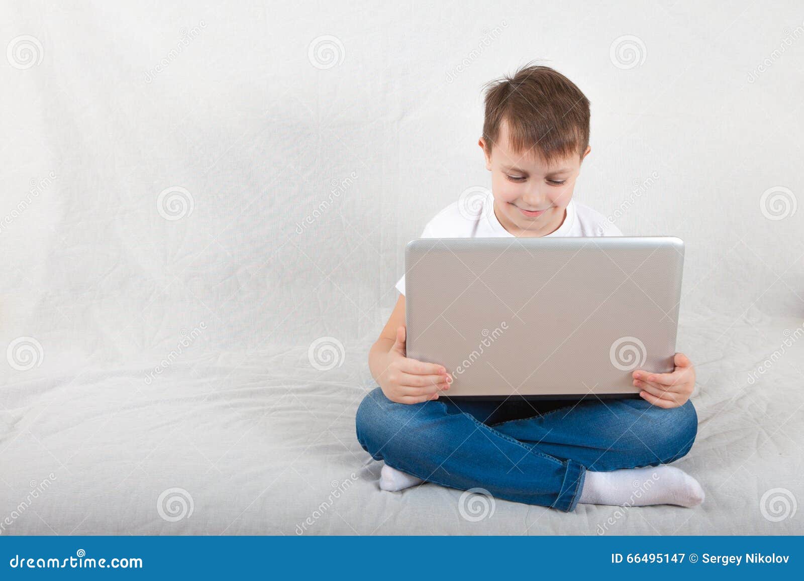Boy with laptop stock image. Image of people, small, game - 66495147