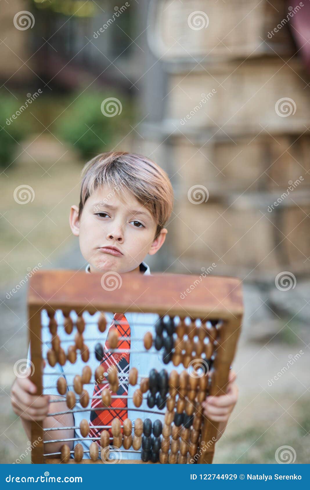 Boy With Large Abacus. Thoughtful Schoolboy Using A Maths Abacus ...