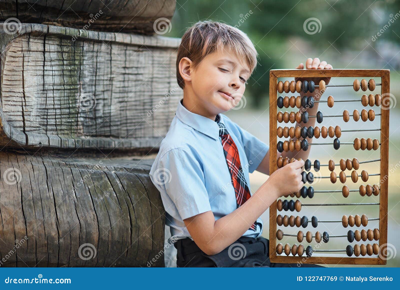 Boy With Large Abacus. Thoughtful Schoolboy Using A Maths Abacus ...