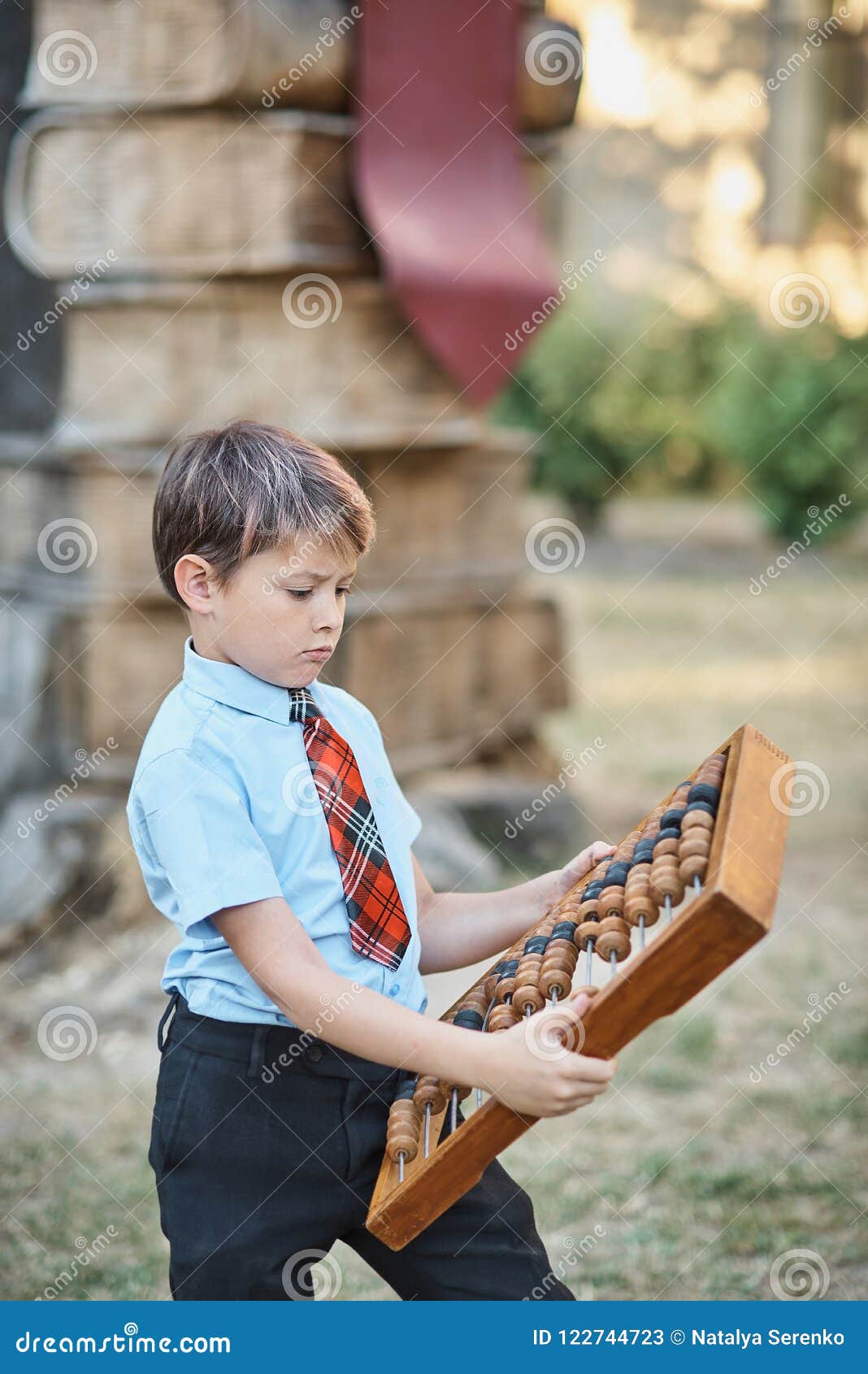 Boy With Large Abacus. Thoughtful Schoolboy Using A Maths Abacus ...