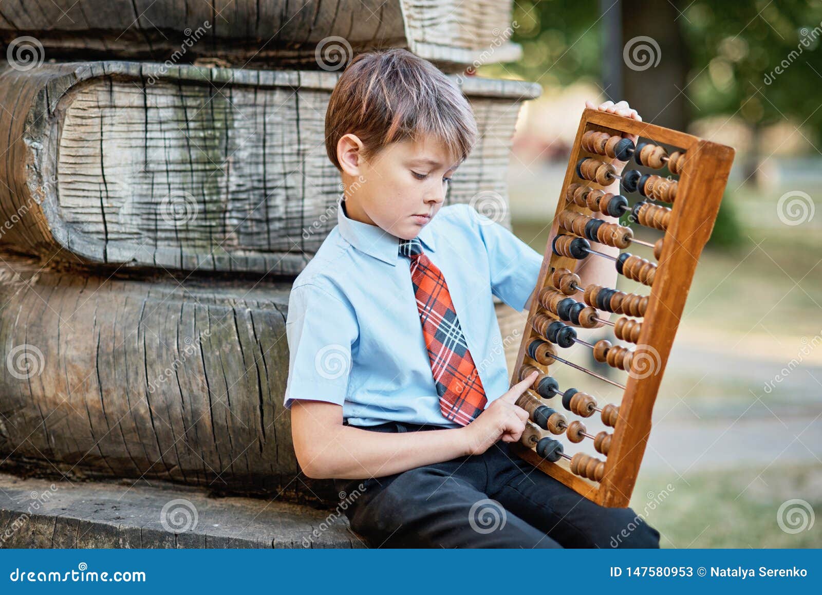 Boy With Large Abacus. Thoughtful Schoolboy Using A Maths Abacus ...