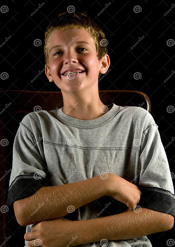 Boy laughing stock image. Image of folded, sitting, handsome - 10485251