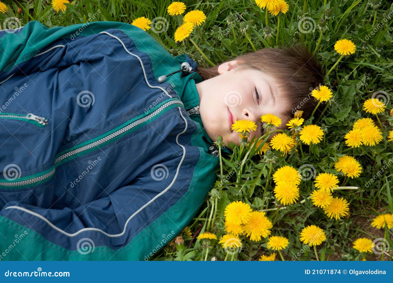 The boy lay on the grass stock photo. Image of sunny - 21071874