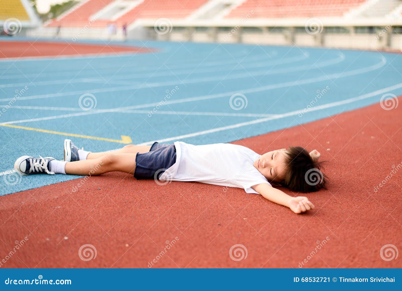 Boy Lay on the Running Track Stock Image - Image of summer, competition ...