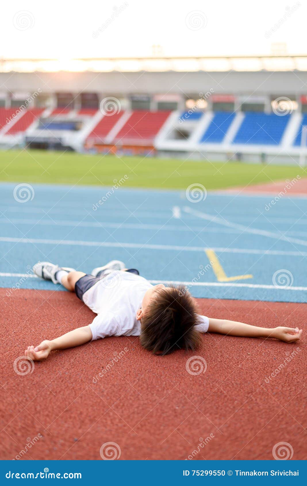 Boy Lay on the Running Track Stock Photo - Image of competition, asian ...