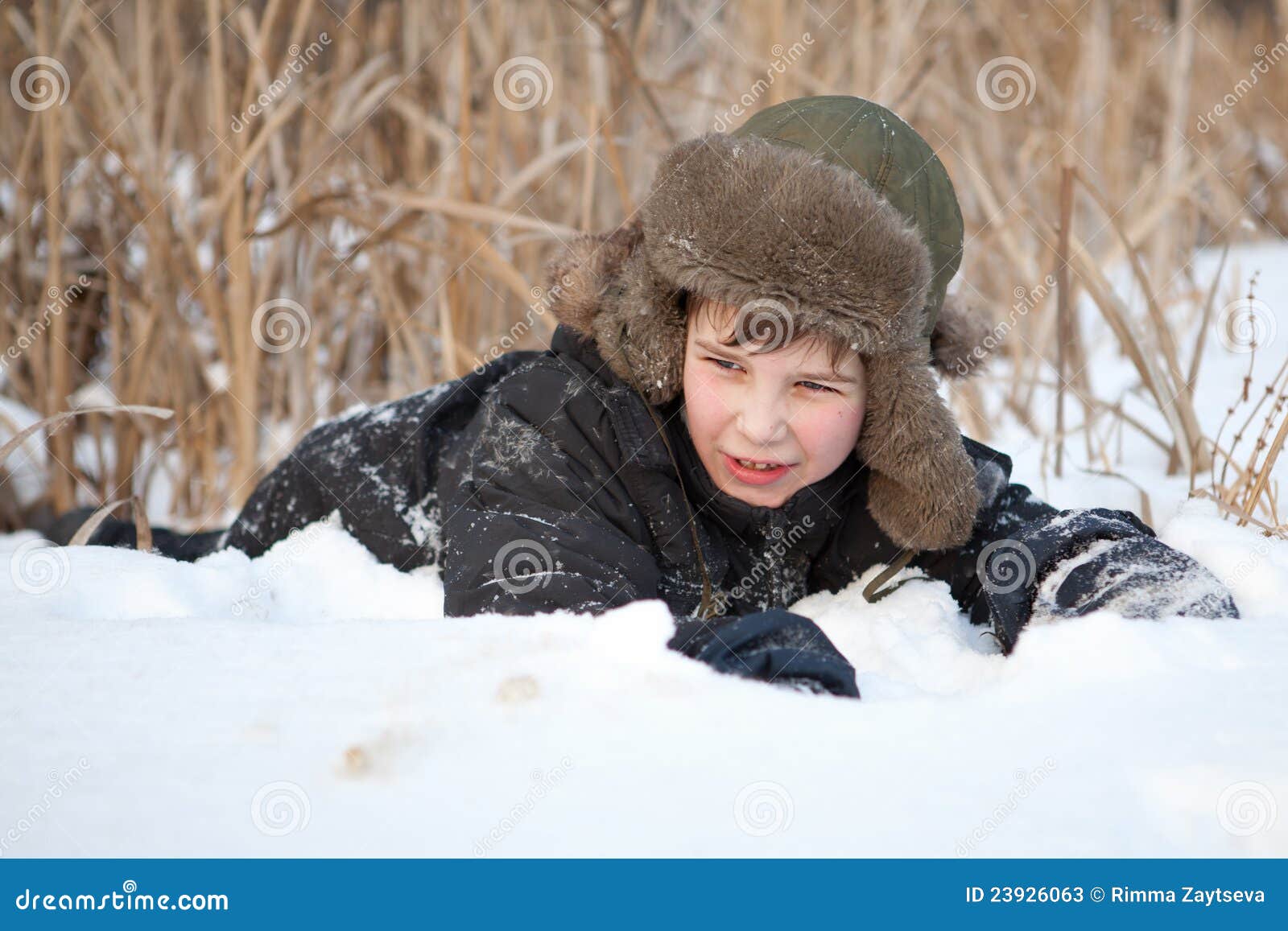 Boy lay on snow, winter stock image. Image of male, winter - 23926063