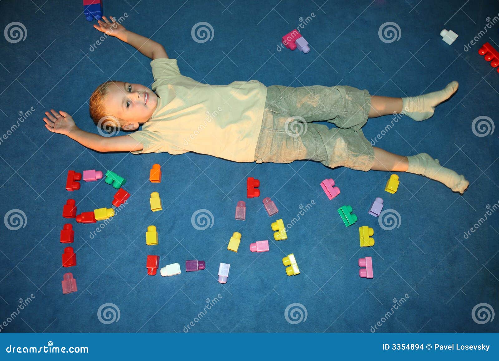 Boy laying on floor stock photo. Image of childish, clothing - 3354894