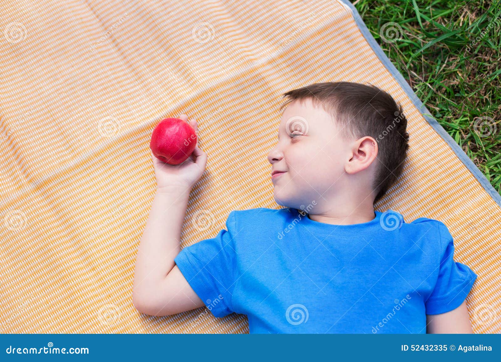 Boy Laying on Mat and Look at Apple Stock Image - Image of happiness ...