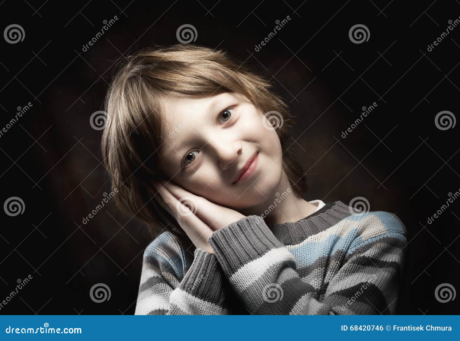 Boy Leaning His Head on His Hands Stock Photo - Image of lean, leaning ...