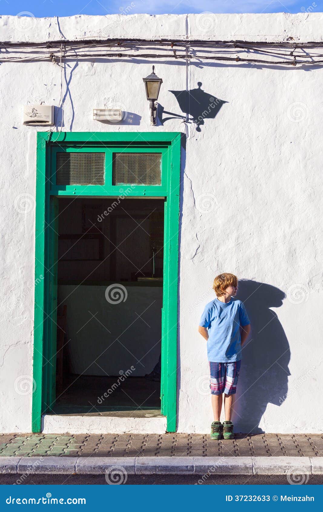 Boy Leaning at a Wall and Throwing a Funny Shadow Stock Image - Image ...