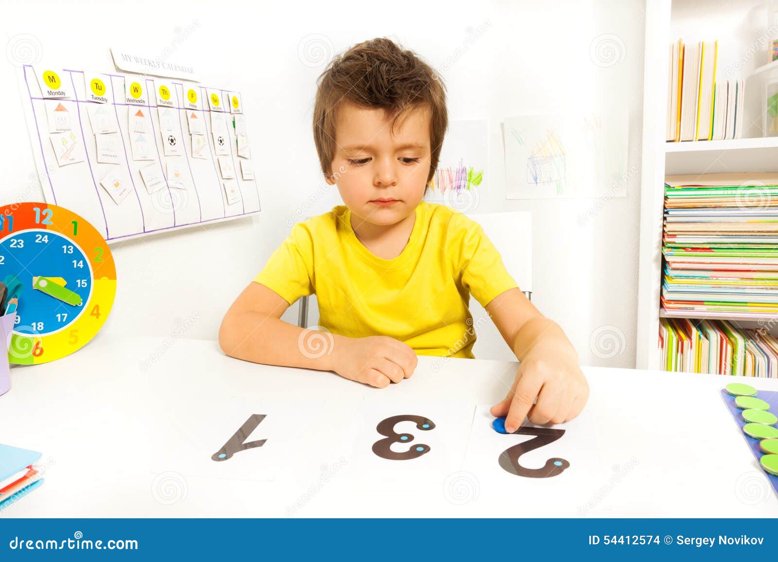 Boy Learn To Count Put Coins on the Numbers Stock Photo - Image of ...