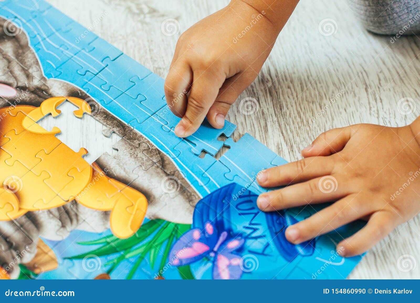 Boy Learning How To Solve a Puzzle Stock Photo - Image of learning ...
