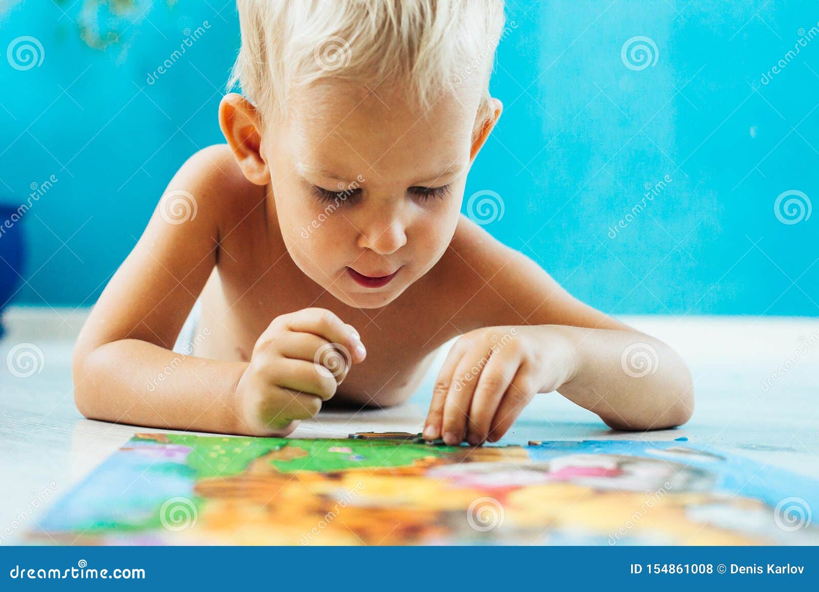 Boy Learning How To Solve a Puzzle Stock Photo - Image of childhood ...