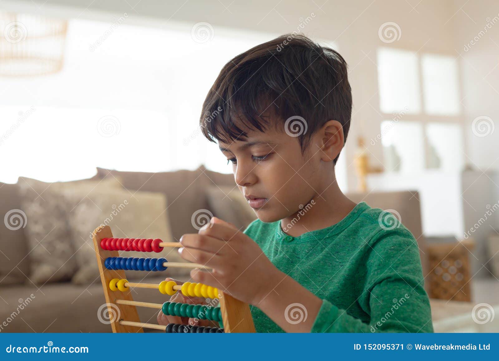 Boy Learning Mathematics with Abacus in a Comfortable Home Stock Image ...