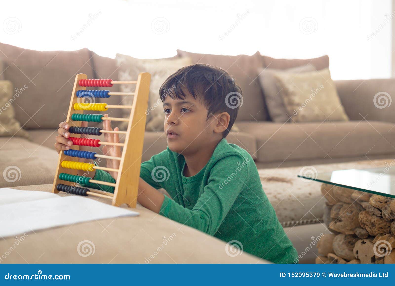 Boy Learning Mathematics with Abacus in a Comfortable Home Stock Image ...