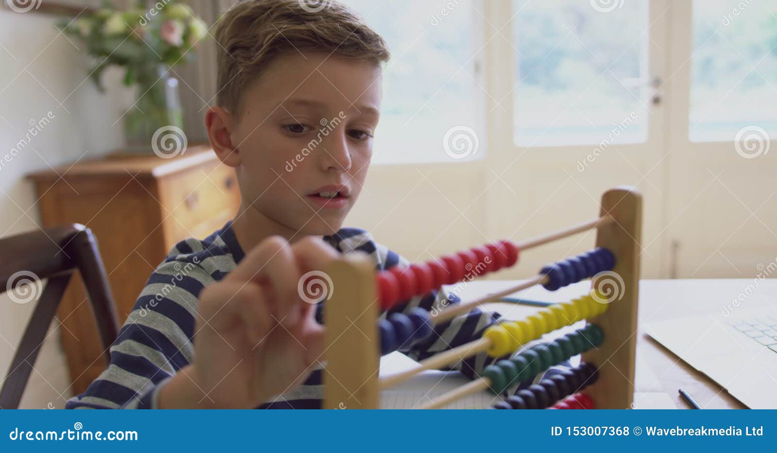 Boy Learning Mathematics on Abacus at Table in a Comfortable Home 4k ...