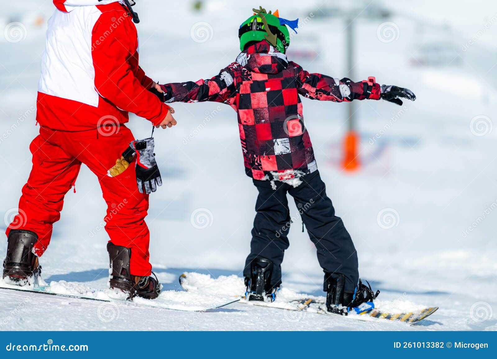 Boy Learning Snowboarding with an Instructor Stock Photo - Image of ...