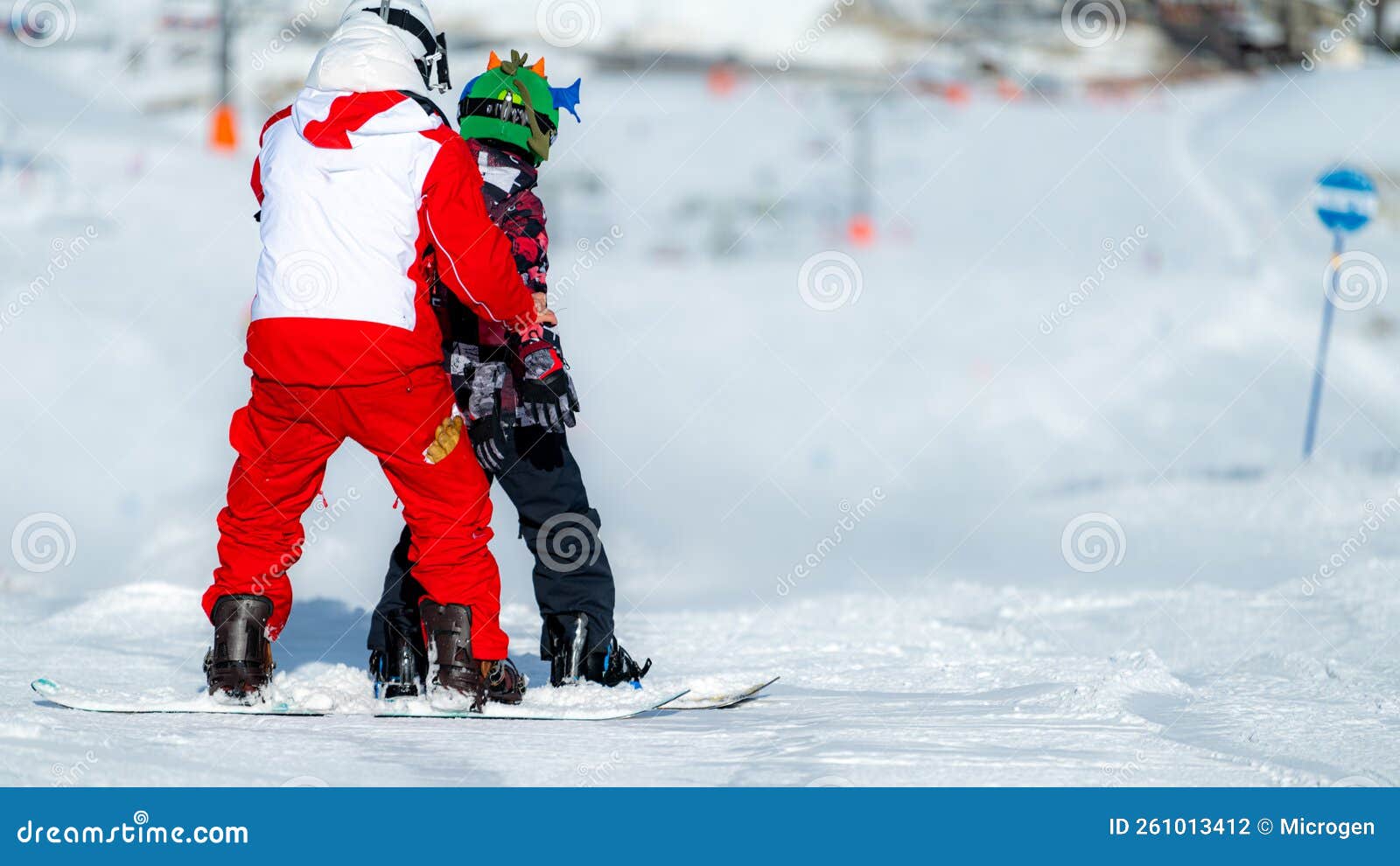 Boy Learning Snowboarding with an Instructor Stock Photo - Image of ...