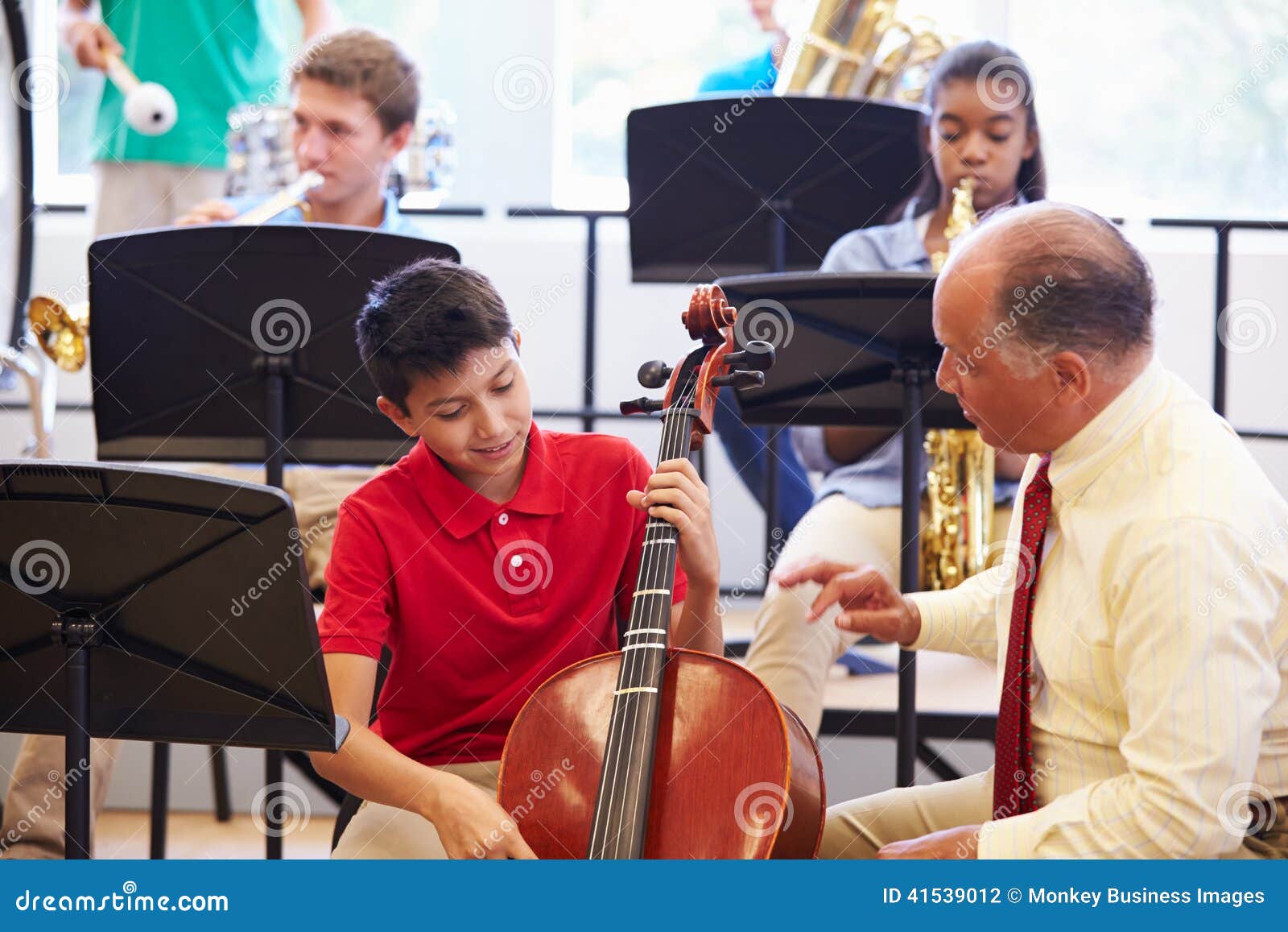 Boy Learning To Play Cello in High School Orchestra Stock Photo - Image ...