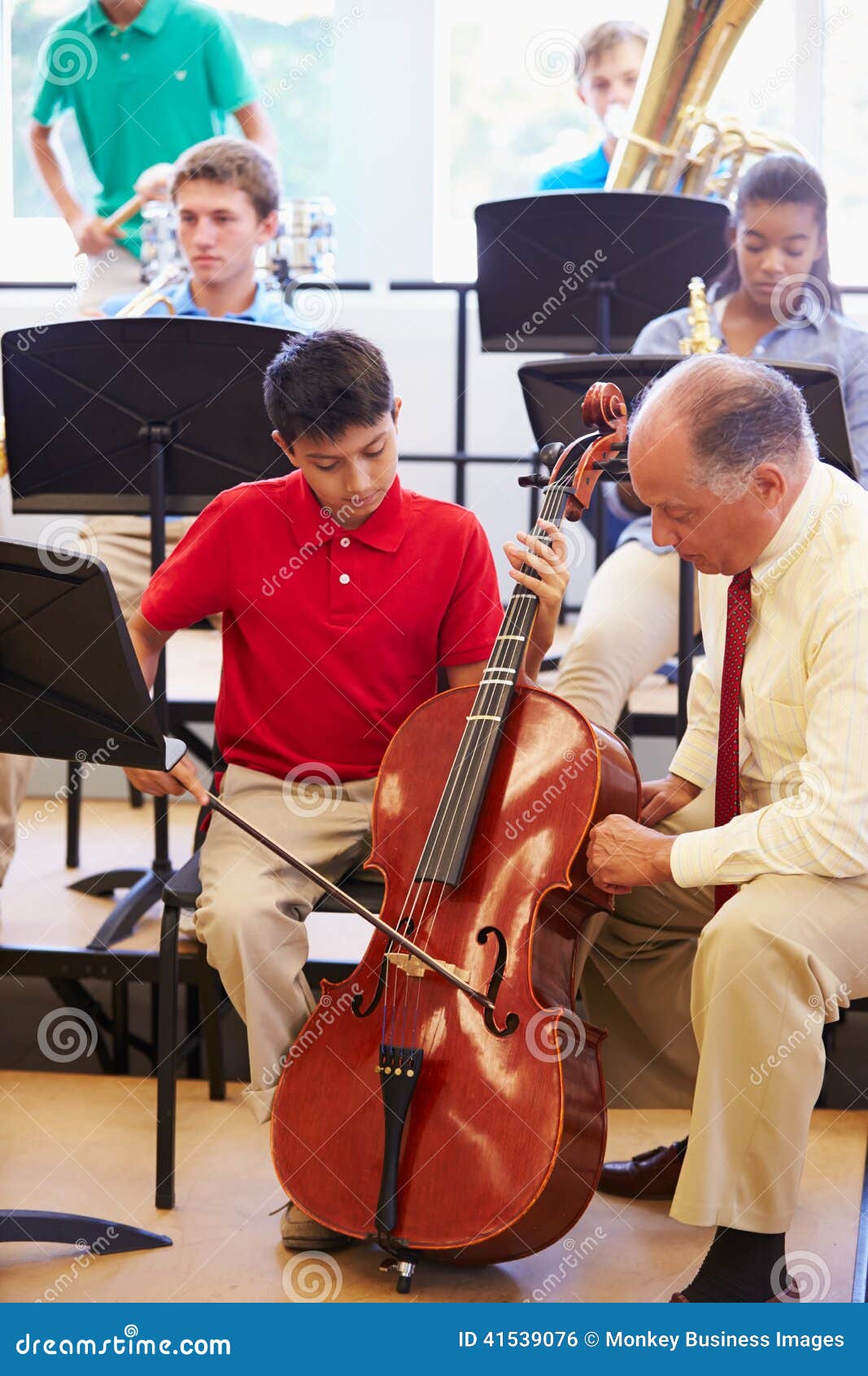 Boy Learning To Play Cello in High School Orchestra Stock Photo - Image ...