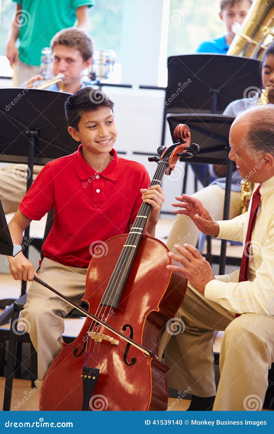 Boy Learning To Play Cello in High School Orchestra Stock Photo - Image ...