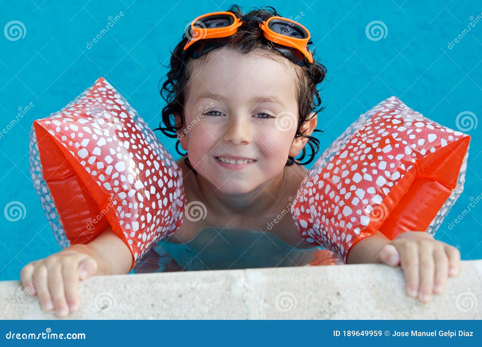 Boy learning to swim stock image. Image of learning - 189649959