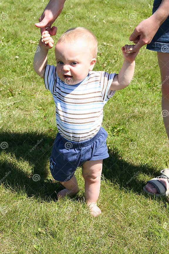 Boy learning to walk stock image. Image of persons, children - 1036661