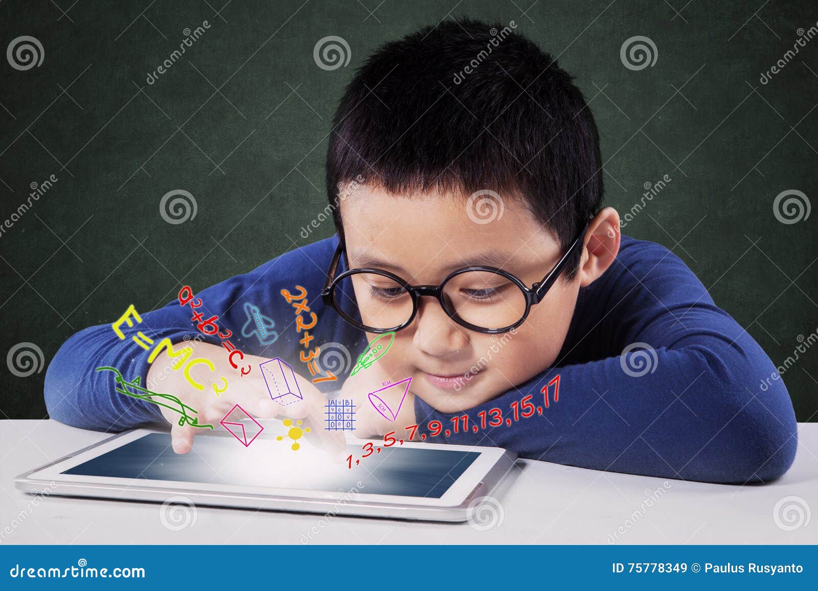 Boy Learns with Tablet on Desk in Class Stock Image - Image of glasses ...